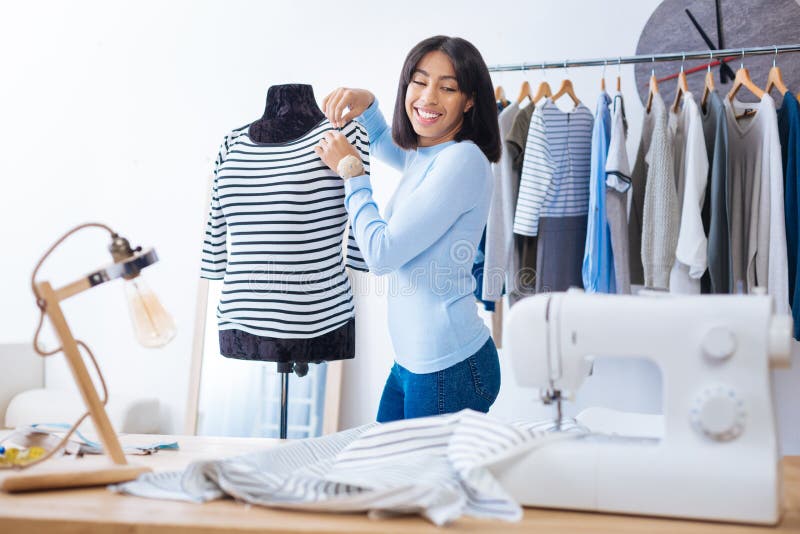 Cheerful Enthusiastic Tailor Looking at the Sewing Machine and Smiling ...