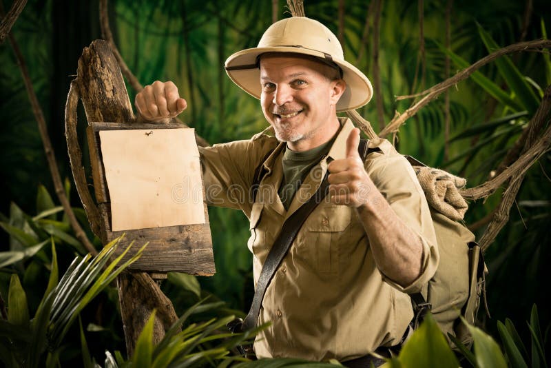 Cheerful Explorer Pointing To a Sign Stock Image - Image of tourist ...