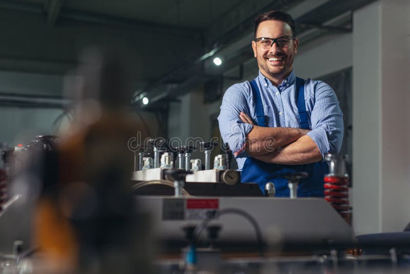 Cheerful Factory Worker with Arms Crossed. Stock Photo - Image of ...