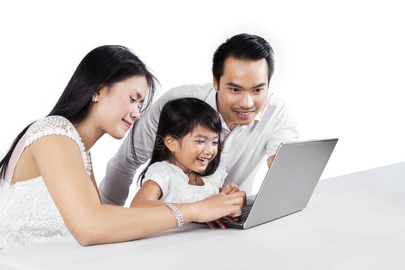Cheerful Family with Laptop in Studio Stock Photo - Image of chinese ...