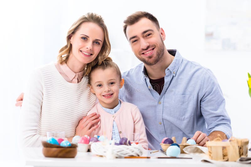 Cheerful Family Smiling by Painted Eggs Stock Image - Image of ...