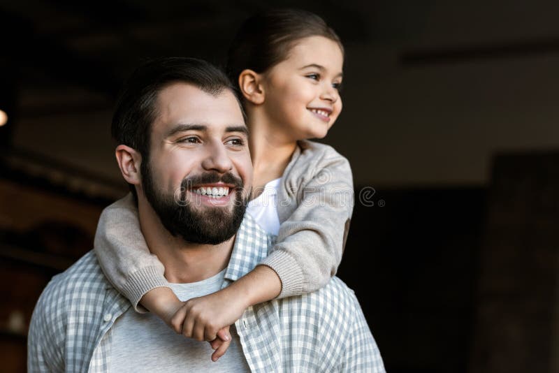 Cheerful Father and Daughter Hugging and Looking at Side Stock Image ...