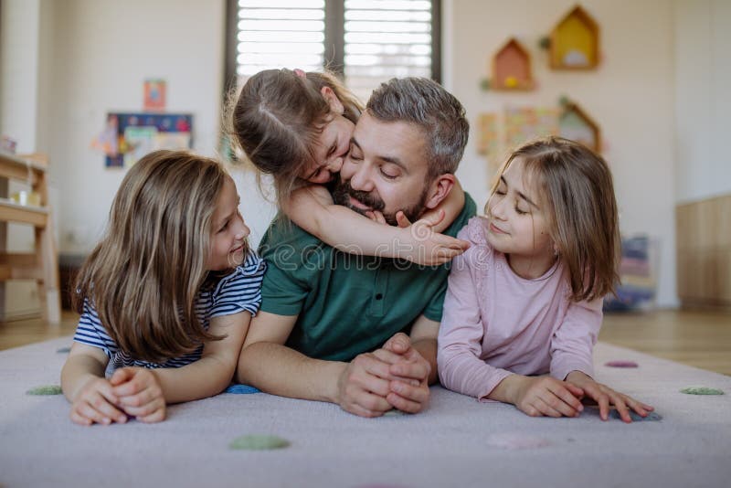 Cheerful Father with Three Little Daughters Playing Together at Home ...