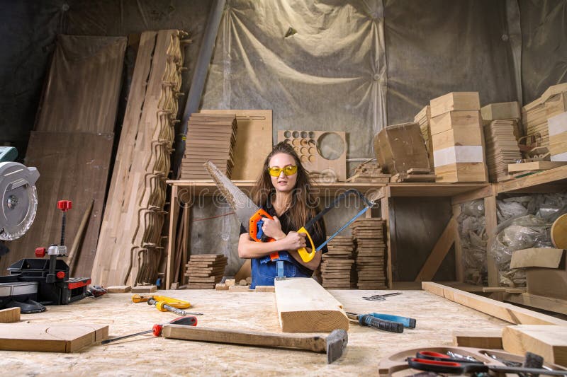 Cheerful female carpenter stock photo. Image of orbit - 299779750