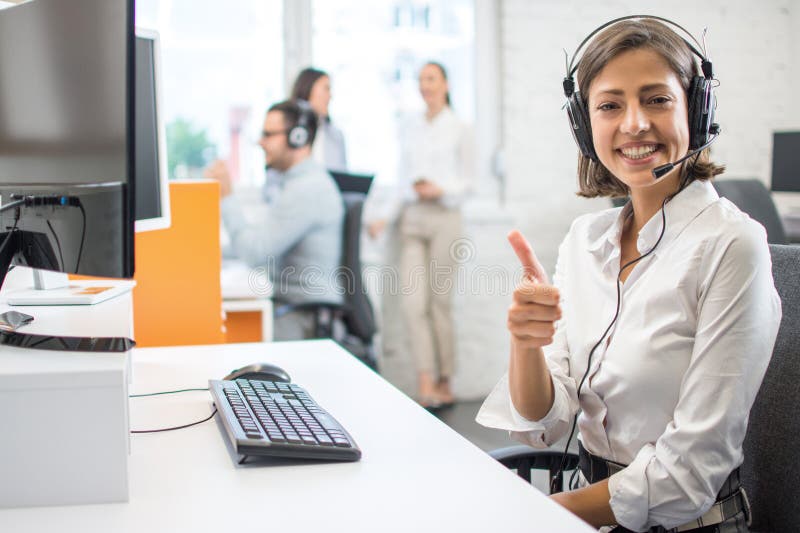 Cheerful Female Customer Service Operator Showing Thumbs Up in Office ...