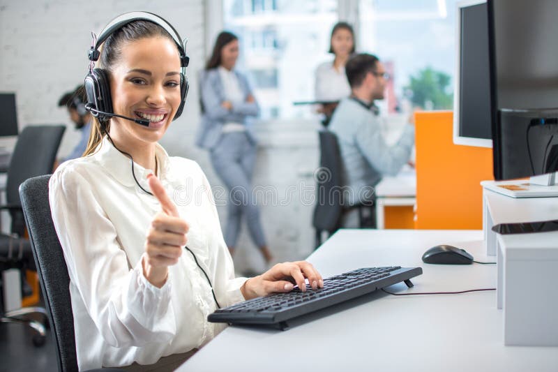 Cheerful Female Customer Service Operator Showing Thumbs Up in Office ...