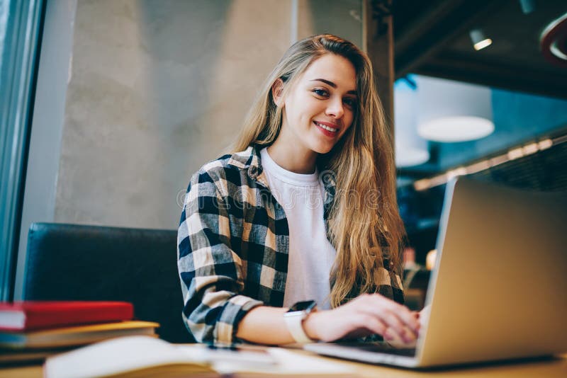 Cheerful Female it Developer Looking at Cafeteria Window after Work on ...