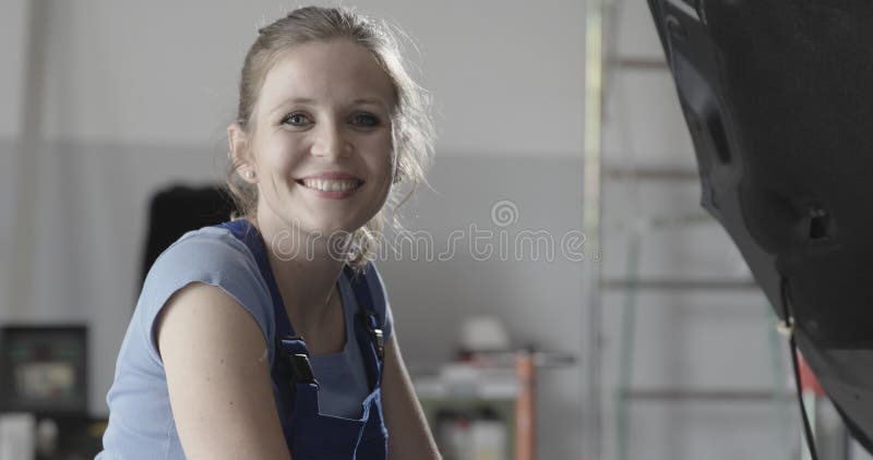 Cheerful Female Mechanic in the Car Workshop Stock Photo - Image of ...