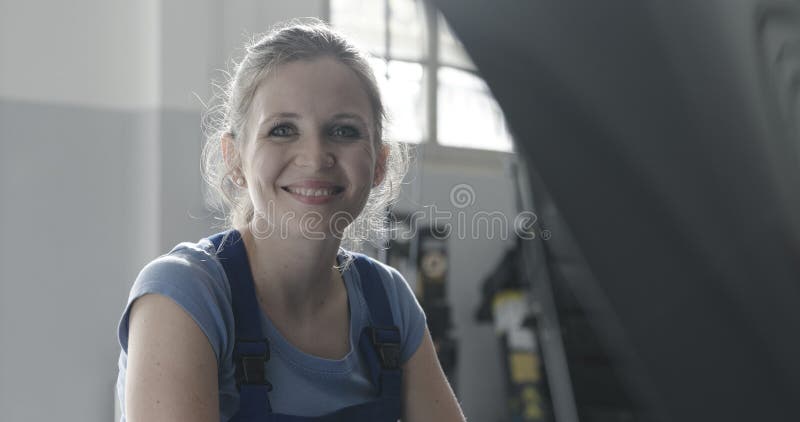 Cheerful Female Mechanic in the Car Workshop Stock Photo - Image of ...