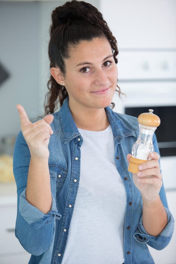 Cheerful Female Standing with Salt in Kitchen Stock Image - Image of ...