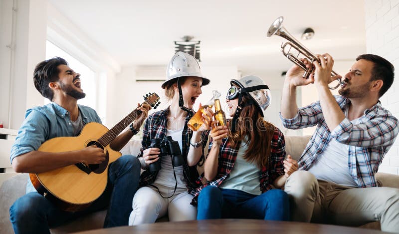 Cheerful Friends Having Party Together and Playing Instruments Stock ...