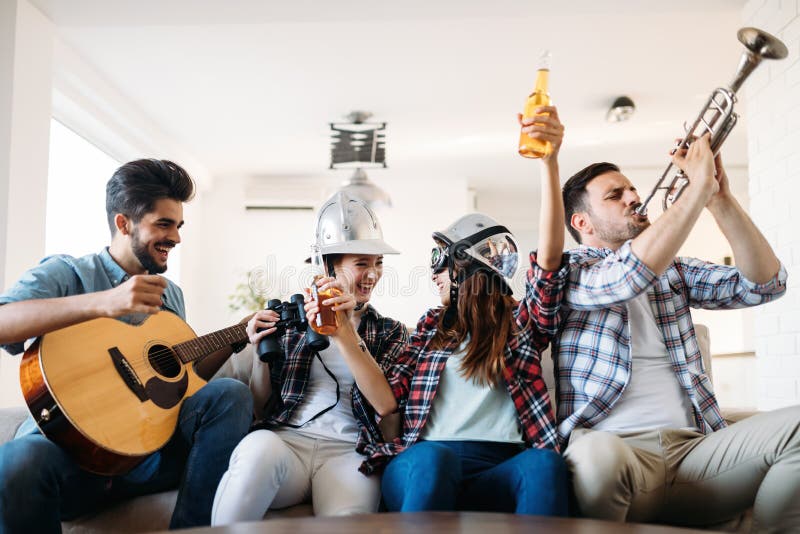 Cheerful Friends Having Party Together and Playing Instruments Stock ...
