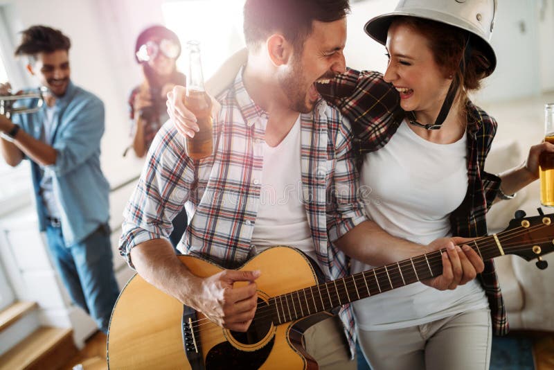 Cheerful Friends Having Party Together and Playing Instruments Stock ...