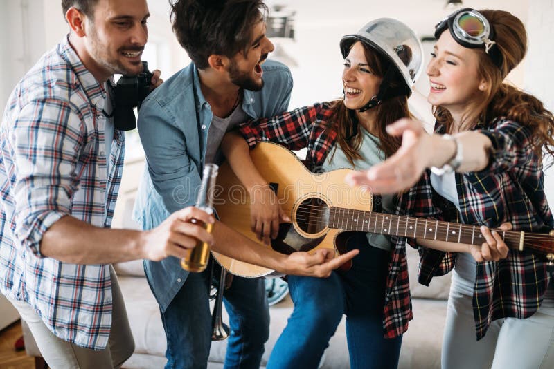 Cheerful Friends Having Party Together and Playing Instruments Stock ...