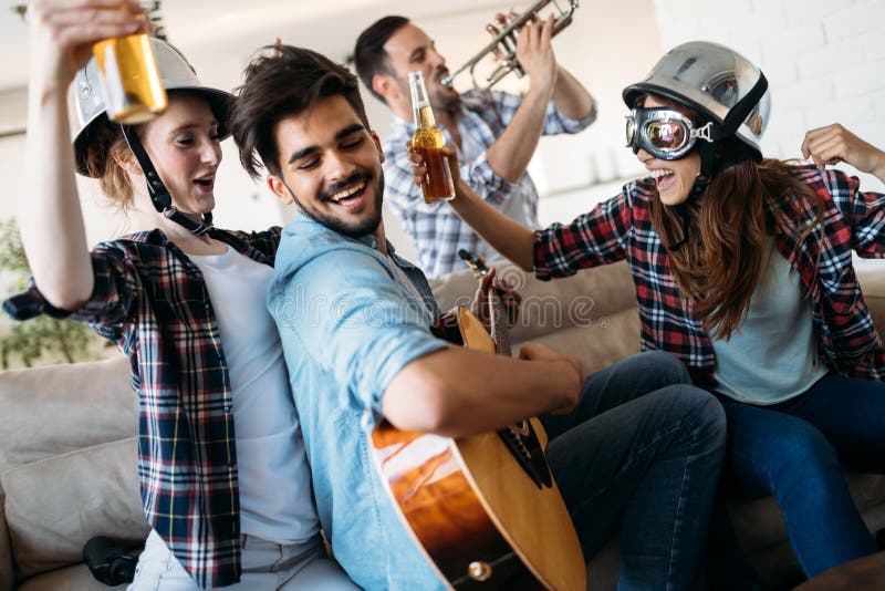 Cheerful Friends Having Party Together and Playing Instruments Stock ...