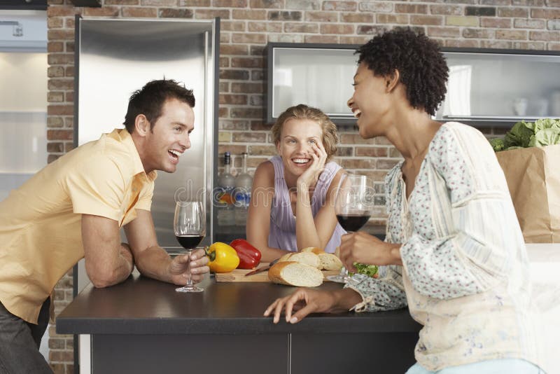 Cheerful Friends at Kitchen Counter Stock Photo - Image of alcohol ...