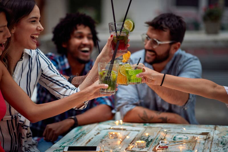 Cheerful Friends Making a Toast at Night Party Stock Image - Image of ...