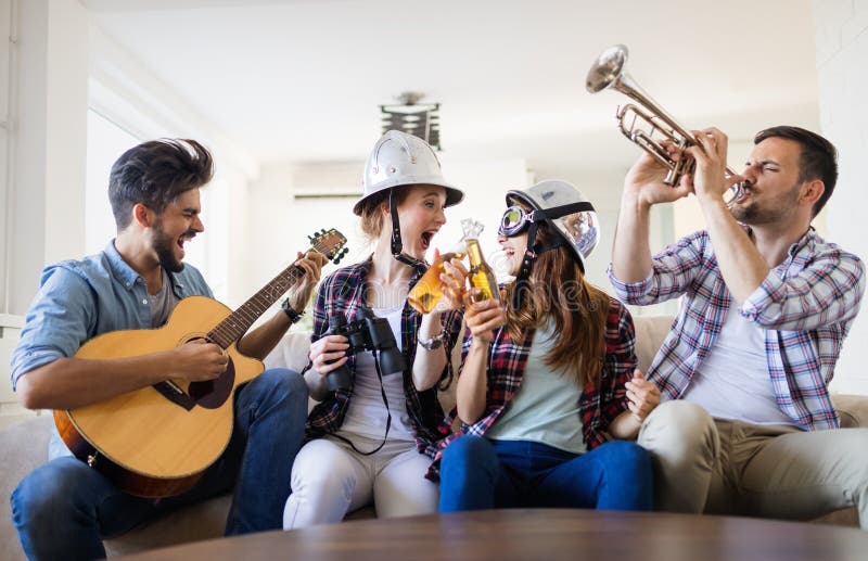 Cheerful Friends Playing on Music Instruments and Having Fun at Home ...