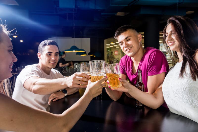 Cheerful Friends in the Pub. Drinking Beer, Talking, Having Fun Stock ...