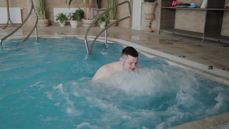 Cheerful Funny Man Swimming in Jacuzzi Pool. Stock Footage - Video of ...