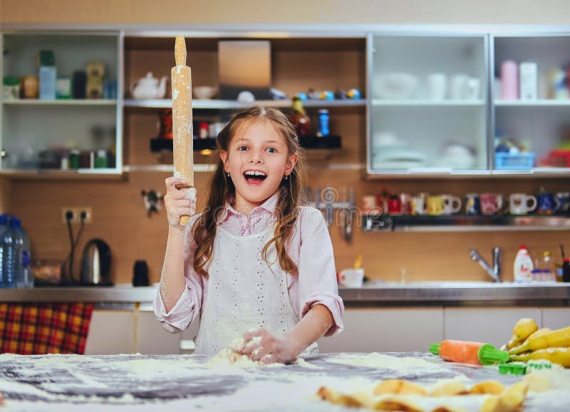 Cheerful Girl Cooking Dough at the Kitchen. Stock Image - Image of kids ...