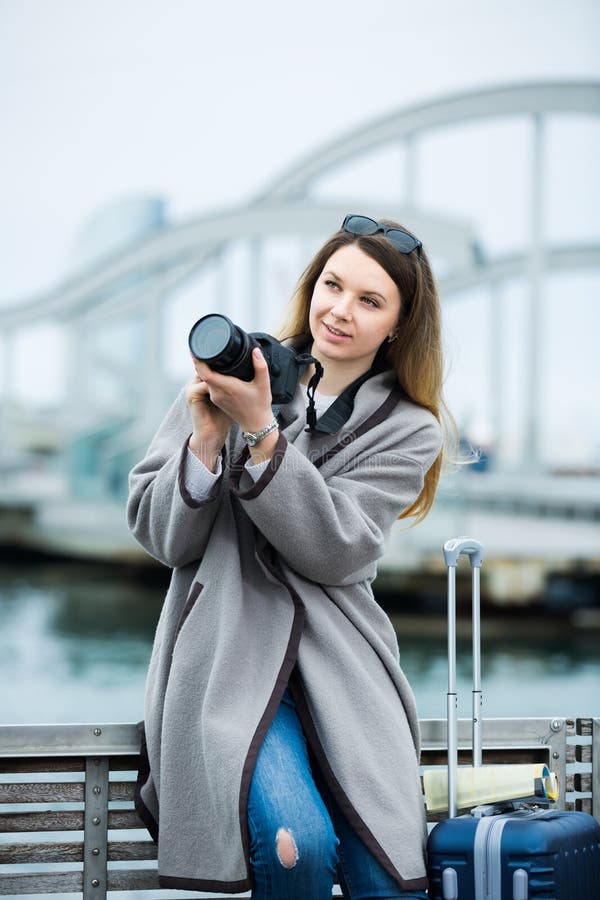 Cheerful Girl Taking Picture with Her Camera Stock Photo - Image of ...