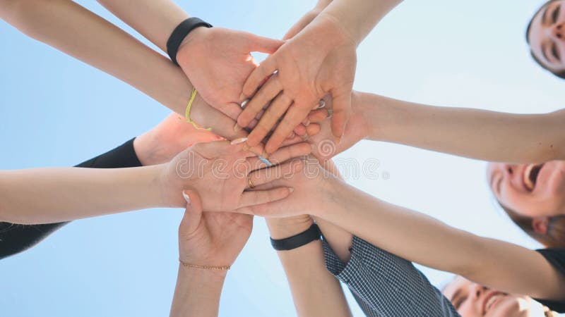 Cheerful Girls Join Hands Together As a Sign of Unity and Joint ...