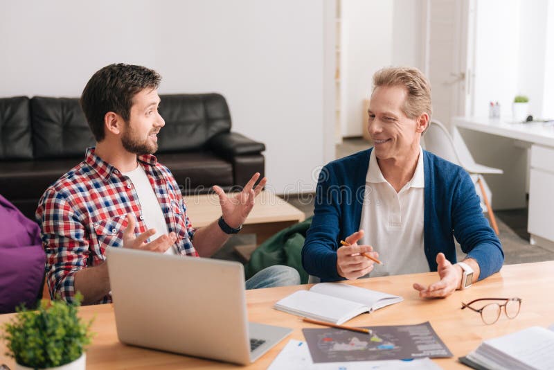 Cheerful Good Looking Men Having a Conversation Stock Photo - Image of ...