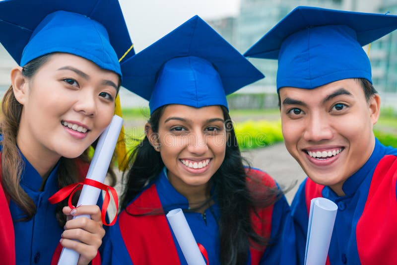 Cheerful graduates stock image. Image of girl, degree - 54890657