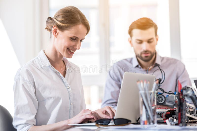 Cheerful Group of Engineers Laboring in Office Stock Image - Image of ...
