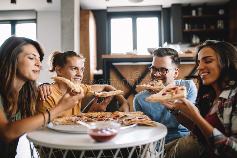 Cheerful Group of Friends Having Fun at Home,eating Pizza. Stock Photo ...