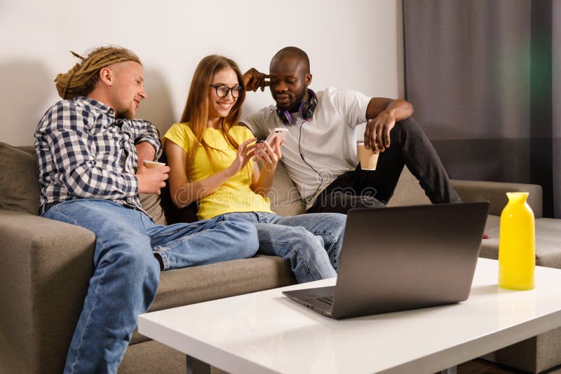 Friends Having Fun at Home stock image. Image of livingroom - 155327089