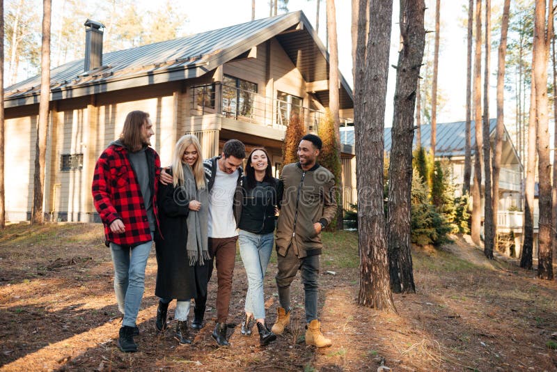 Cheerful Group of Friends Walking Outdoors in the Forest. Stock Image ...
