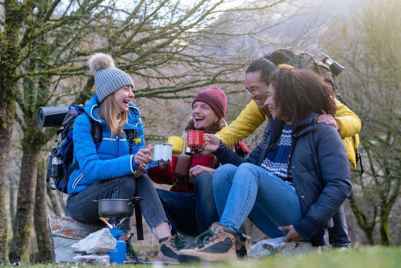Cheerful Group of Young Hikers Take Breakfast on the Mountain Stock ...