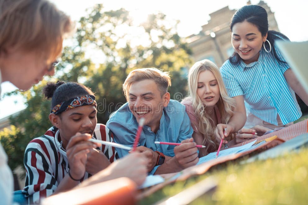 Cheerful Groupmates Helping Each Other Solving Problems. Stock Image ...
