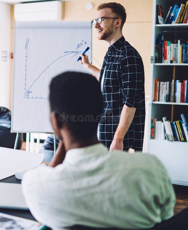 Cheerful Guy Showing Graph To Colleagues Stock Photo - Image of ...