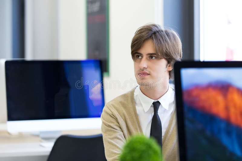 Cheerful Guy Sitting in Front of Desktop Computer Stock Photo - Image ...