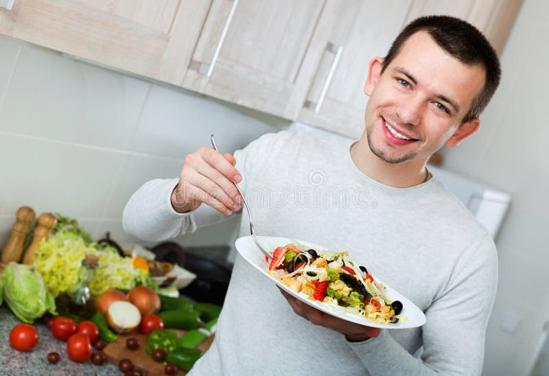 Cheerful Handsome Man Holding Plate Stock Image - Image of onion ...