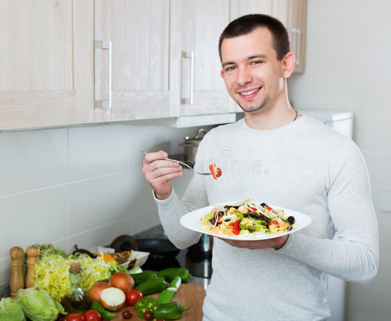 Cheerful Handsome Man Holding Plate Stock Photo - Image of condiments ...