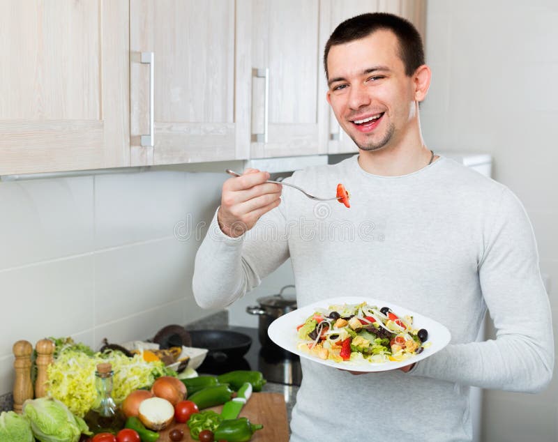 Cheerful Handsome Man Holding Plate with Salad Stock Photo - Image of ...