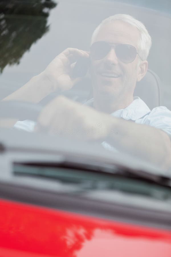 Cheerful Handsome Man in Red Convertible Having Phone Call Stock Photo ...