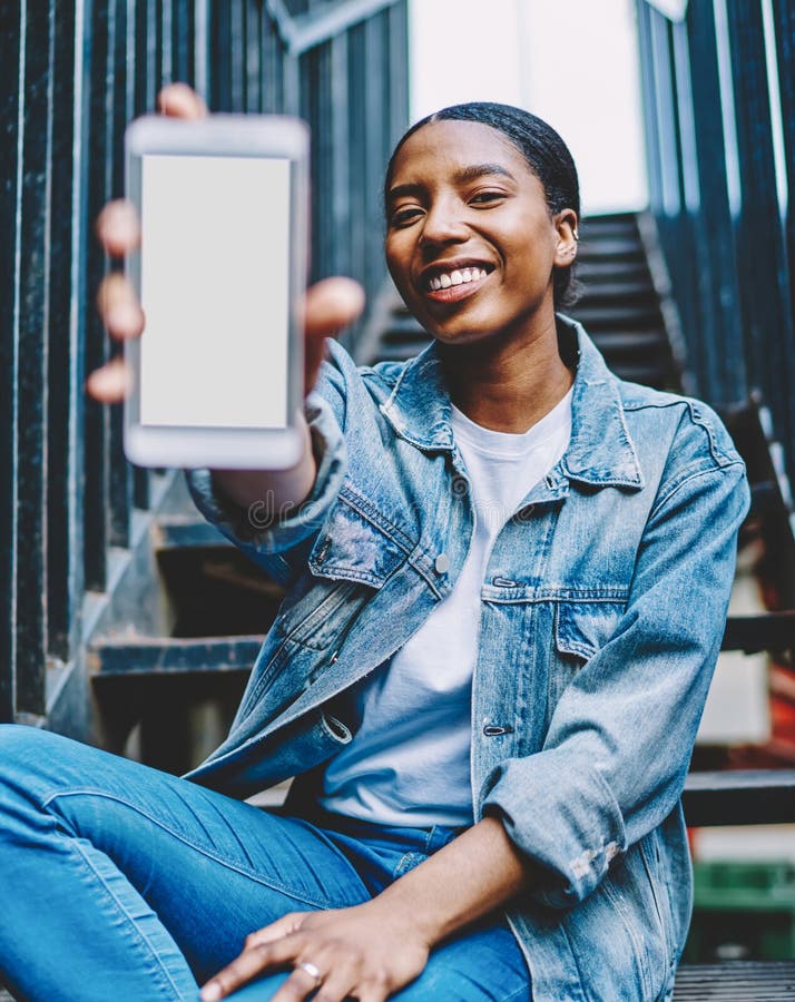 Cheerful and Happy Dark Skinned Blogger Holding in Hand Mobile Phone ...