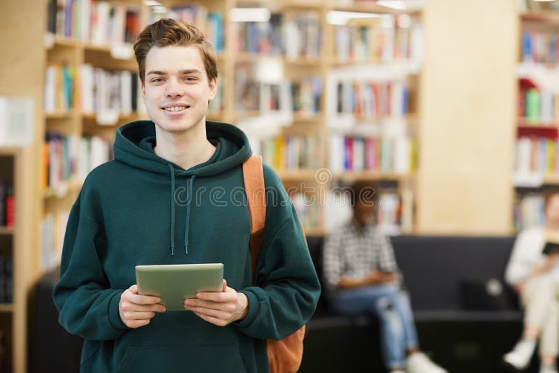 Cheerful High School Student with Tablet Stock Photo - Image of library ...