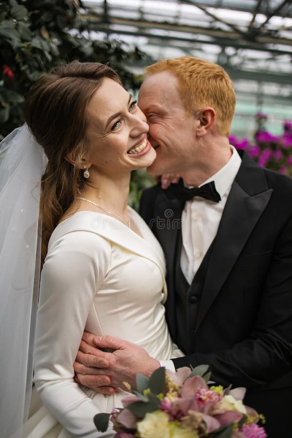Cheerful Hugging Just Married in the Lovely Garden. Stock Image - Image ...
