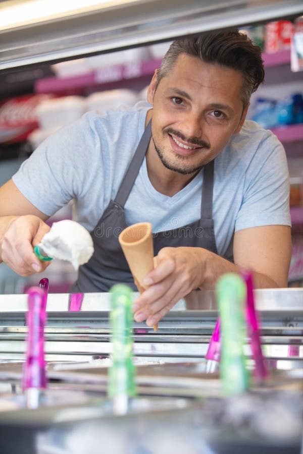 Cheerful Ice Cream Seller Serving Ice Cream Stock Photo - Image of ...