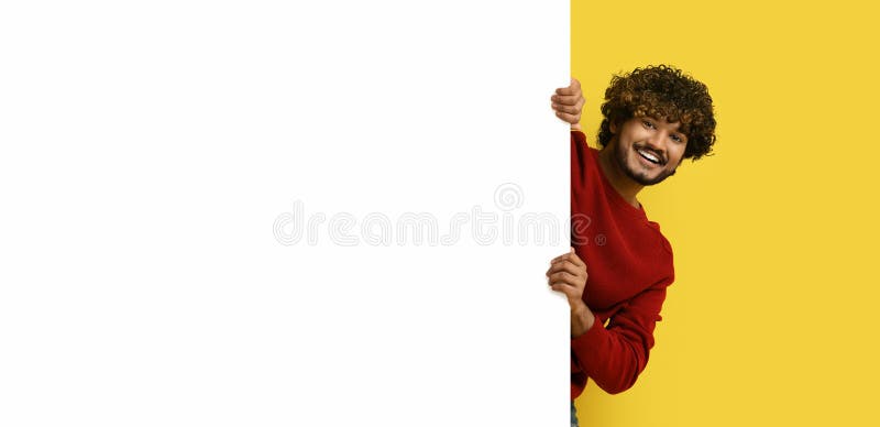 Cheerful Indian Guy Looking from Behind White Board Stock Image - Image ...