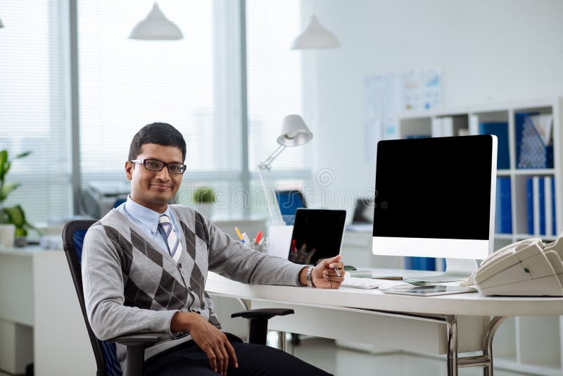 Cheerful Indian manager stock photo. Image of writing - 54668938