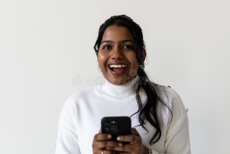 Cheerful Indian Young Woman Using Smart Phone on White Background Stock ...