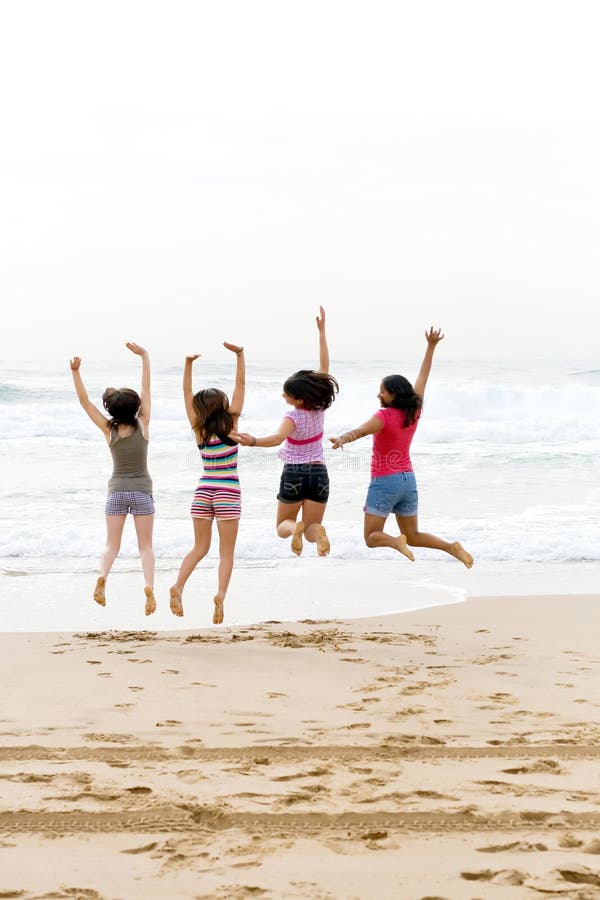 Beach jump stock photo. Image of four, games, joyful - 10972442