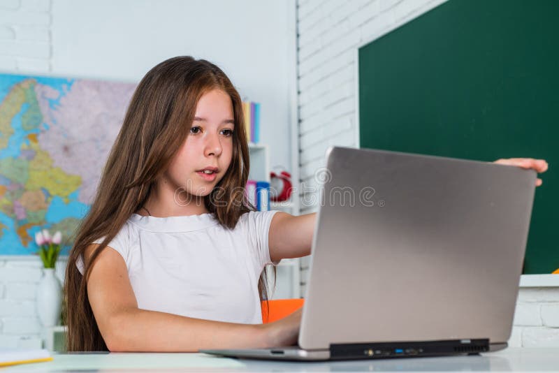 Cheerful Kid Girl with Computer at School Lesson, E Learning Stock ...